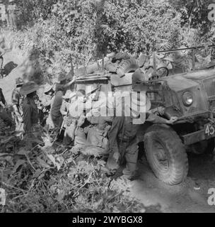 Men of the 36th Infantry Division in Burma, February 1945, dig a gun ...