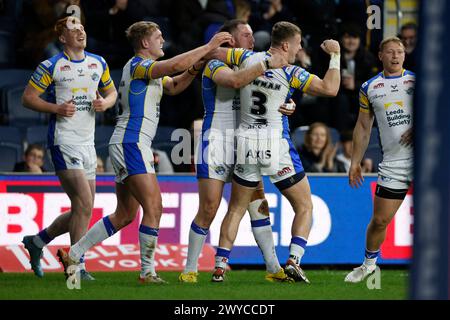 Harry Newman of Leeds Rhinos celebrates his try during the Betfred ...