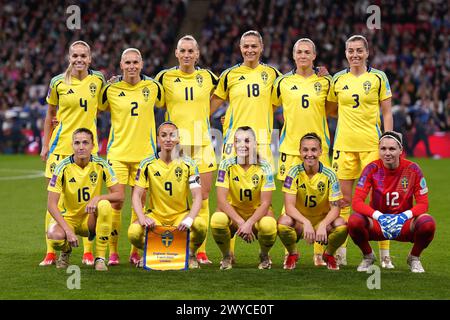 Sweden goalkeeper Jennifer Falk, right, makes a save against England's ...