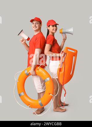 Lifeguards with ring buoy and rescue tube isolated on white background ...