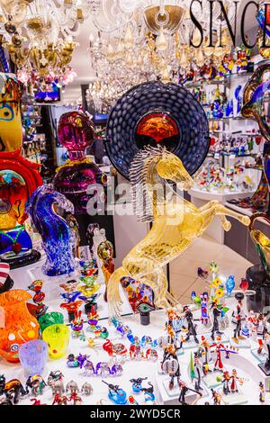 Display of colourful glasswork for tourist souvenirs in a shop window in Castello, Venice, Italy ...