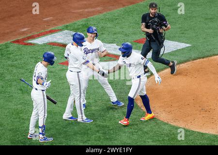 Texas Rangers' Evan Carter, left, scores past Baltimore Orioles catcher ...