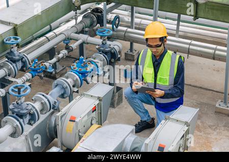 engineer male work checking water pipe inspecting valve testing water ...