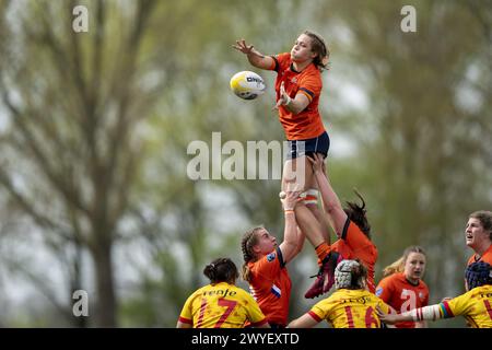 AMSTERDAM - Rugby star Isa Prins of Oranje in action against Claudia ...