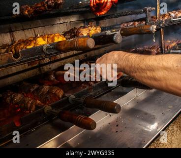 Brazilian style beef ribs Barbecue grill on skewers at a churrascaria ...