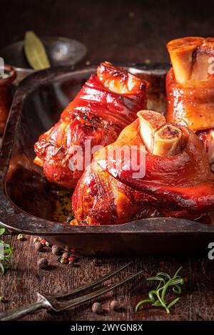 Hot and cripsy roasted ham hock served with sauerkraut and potatoes ...