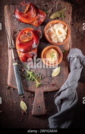 Cripsy roasted pork knuckle served with sauerkraut and potatoes ...