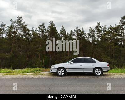 Gray sedan car Opel Omega on the road Stock Photo - Alamy