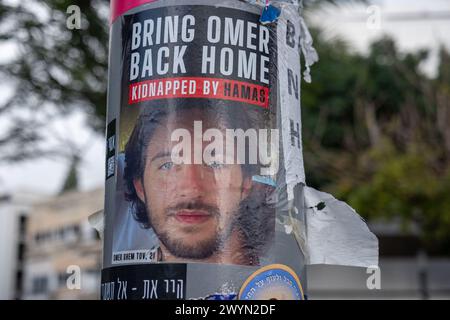 Israeli hostage Omer Shem Tov, centre, is escorted by Hamas fighters ...