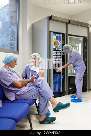 Surgeons taking a coffee in break room, surgical block. Hospital ...