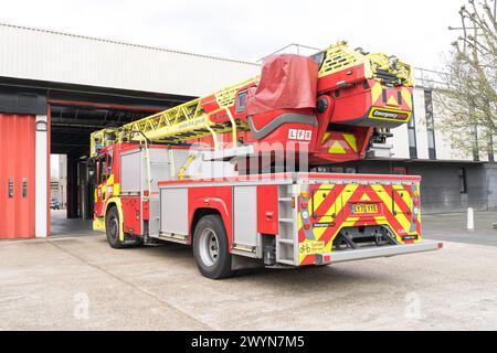 off side rear view of a fire engine returning to depot in Lewisham fire ...