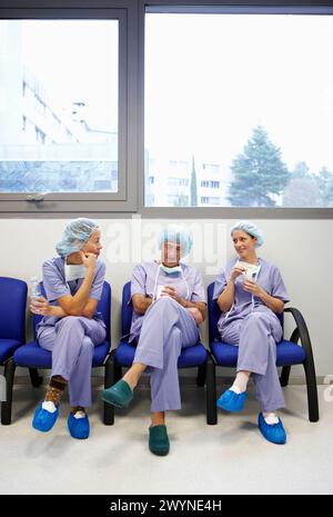 Surgeons taking a coffee in break room, surgical block. Hospital ...