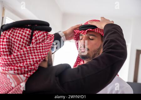 arab support each other even in wears Stock Photo - Alamy