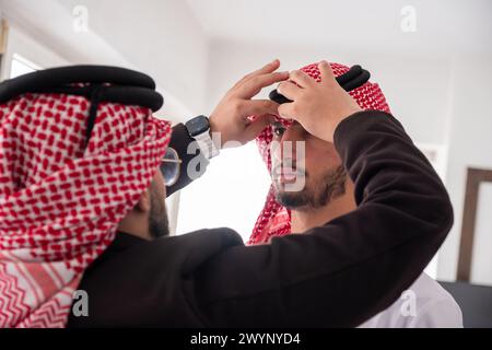 arab support each other even in wears Stock Photo - Alamy