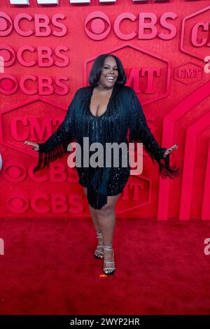Country singer AMBER RILEY walks the red carpet and poses for ...