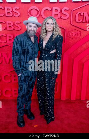 Celebrities pose for photographers on the red carpet, as they arrive ...