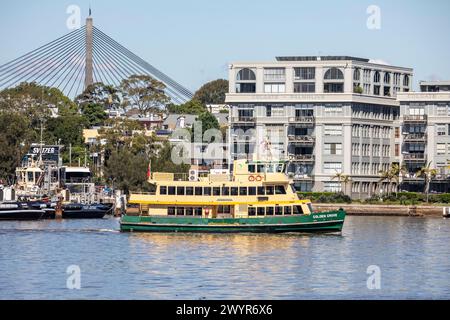 Sydney ferry the Golden Grove passes between port navigation marker and ...