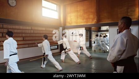 Sensei, Japanese and students in dojo for aikido tradition or respect ...