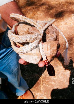 Shepherds sling demonstration. A sling is a projectile weapon typically ...