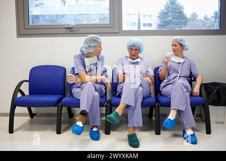 Surgeons taking a coffee in break room, surgical block. Hospital ...