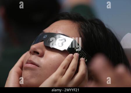 08 April 2024, Mexico, Mazatlán: People watch the total solar eclipse ...
