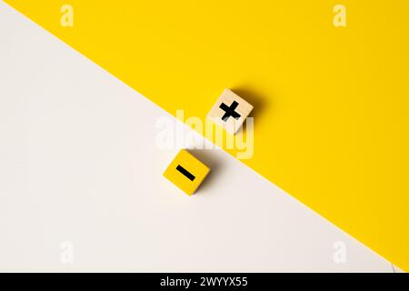 The concept of opposites or pros and cons using plus and minus signs ...