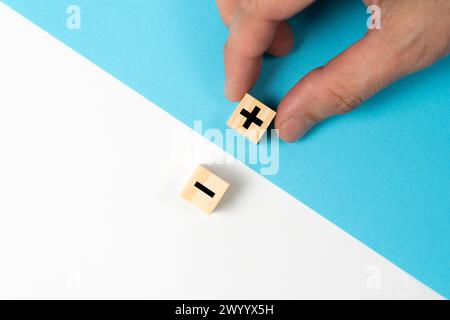 The concept of opposites or pros and cons using plus and minus signs ...