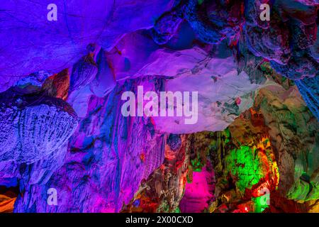 beautiful illuminated multicolored stalactites from karst Silver cave ...