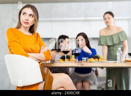 Group of girlfriends at party scold their friend. Quarrel at ...
