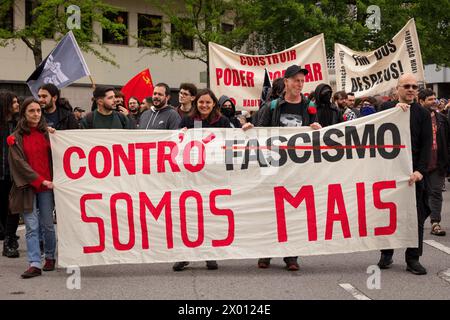 Protesters hold banners and flags during the demonstration.About a ...