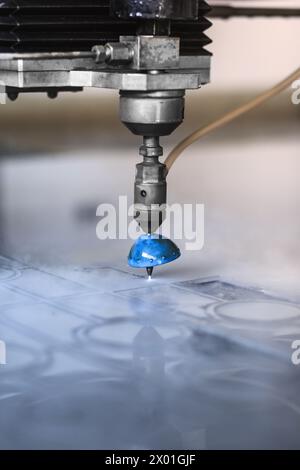 High pressure water jet cutting metal plate Stock Photo - Alamy