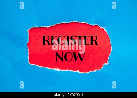 Register now words written on ripped orange paper pieces with purple ...