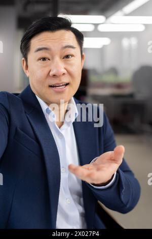 Blurred background of man recording video or taking picture by ...