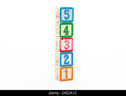 Wooden cubes with figures isolated on white Stock Photo - Alamy