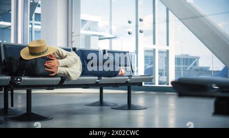 Happy woman at an airport waiting for flight Stock Photo - Alamy
