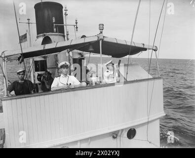 Officers and men of the Ceylon RNVR are seen in Colombo, Ceylon, in ...