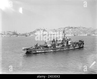 Various German small ships and craft in Ancona, Italy, on May 19, 1945 ...