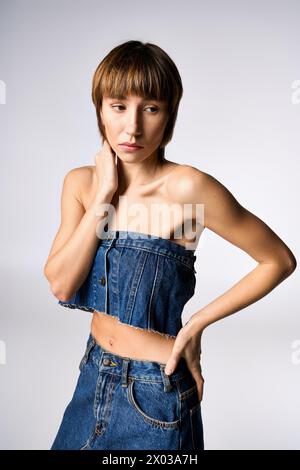 Photo of cool brunette young lady do hair wear t-shirt isolated on pink ...