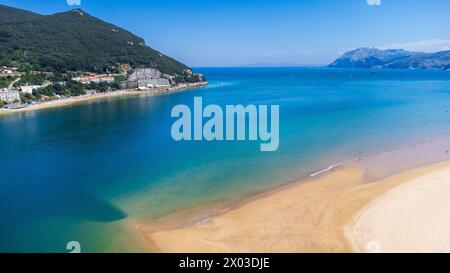 Aerial view of the sandy spit of Laredo, beach washed by the waters of ...