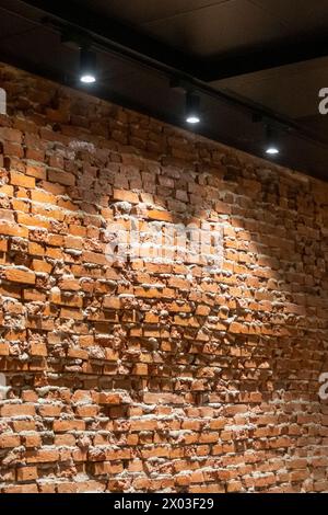 Brick wall with spotlight from the ceiling, highlight its texture Stock ...