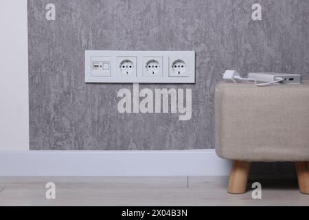 Electric power sockets on grey wall indoors, space for text Stock Photo ...