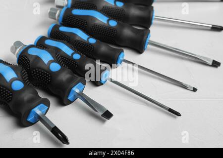 Set of screwdrivers on light grey background, flat lay Stock Photo - Alamy