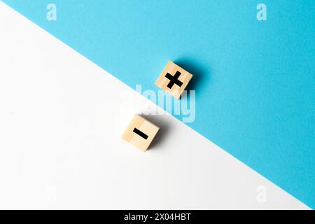 The concept of opposites or pros and cons using plus and minus signs ...