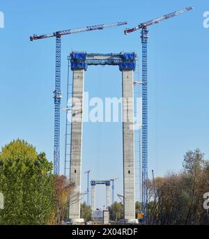Reinforced concrete bridge pillars under construction across the river ...