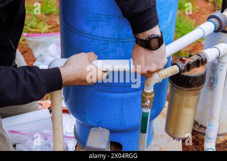Plumber connects water to well pump with an underground pipeline for ...