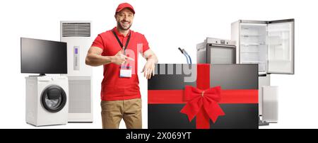 Salesman pointing at a flat lcd tv screen tied with a red ribbon ...