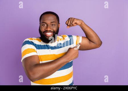 Photo of strong masculine virile guy show two biceps wear green sweater ...