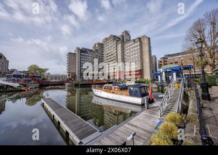 Boats in St Kathrine's Dock marina by Ivory House, with shops, cafes ...