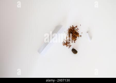 Moroccan hashish or hash, a cigarette, tobacco and a lighter to light ...