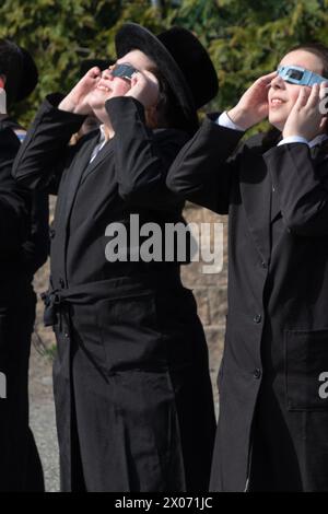 In their schoolyard, 4 orthodox Jewish students watch the 2024 Solar ...